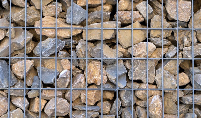 Stones behind bars stock photo. Image of brickwork, geology - 264056480