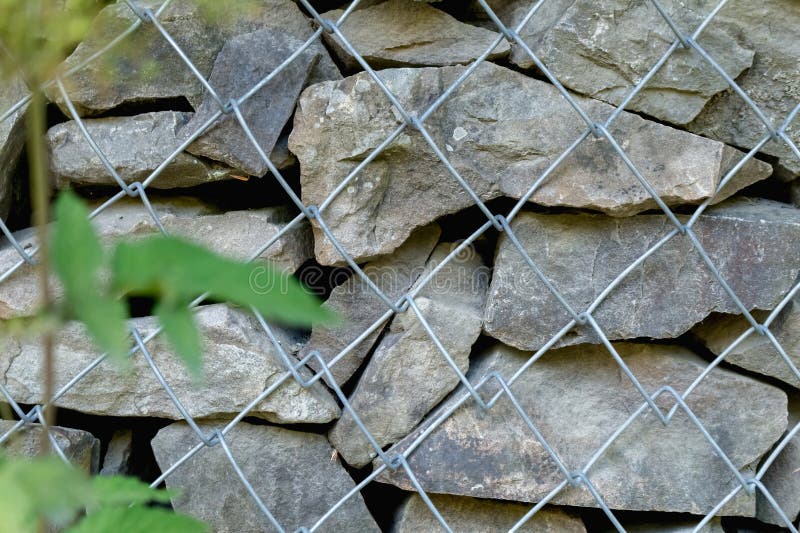 Stones behind the net stock image. Image of road, construction - 282887013