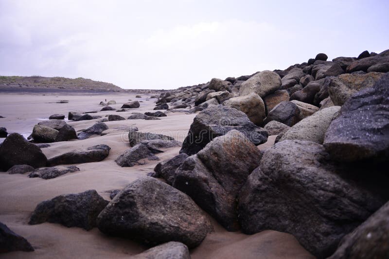 Stones in cipatujah beach stock photo. Image of ocean - 126393602