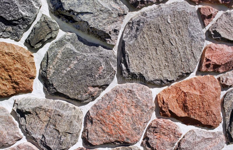 Stones of Different Sizes, Shapes and Colors on an Exterior Rock Wall ...