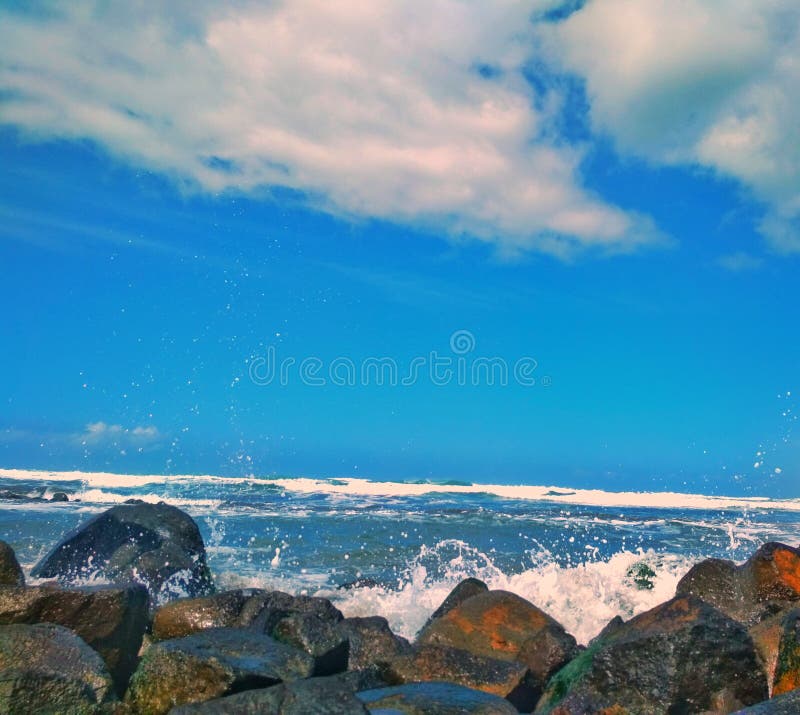 Stones Edge of the Beach,blue Sky and Wave Stock Photo - Image of java ...