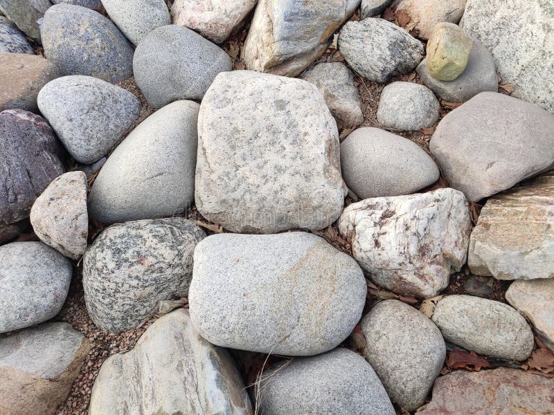 Stones Embedded in Sand Like Wall Stock Photo - Image of stones, sand ...