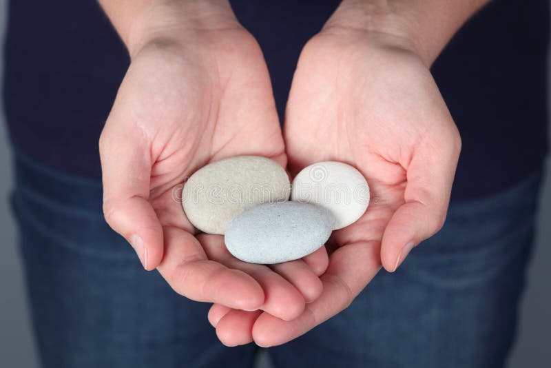 Stones in the Hands of a Child Stock Photo - Image of trio, summer ...