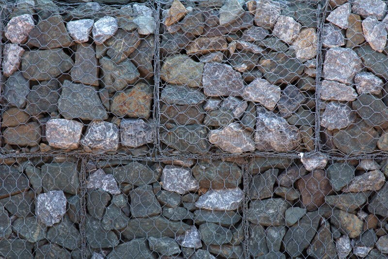 Stones in iron net stock photo. Image of texture, cage - 57163472