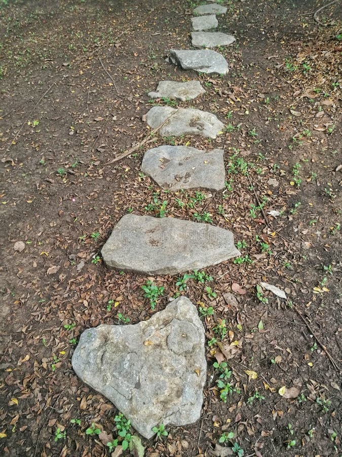 Stones Laid Down a Corridor on the Ground. Stock Image - Image of ...