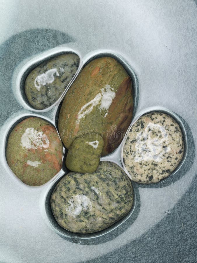 Stones in floating water stock image. Image of hand - 340855531