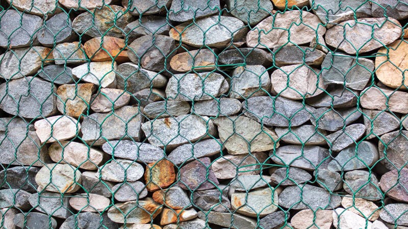 Stones in a Metal Grid As a Background Stock Image - Image of abstract ...