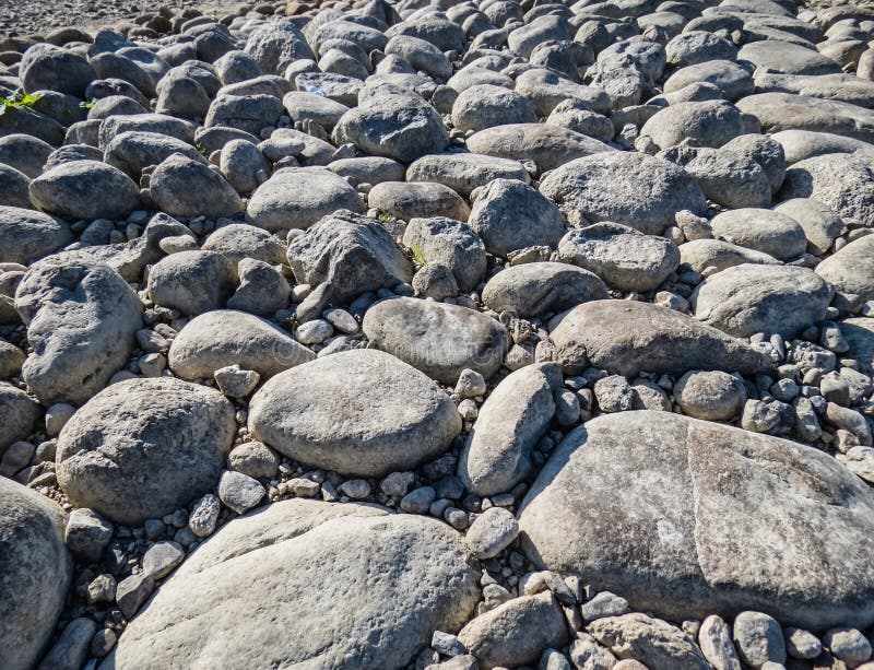 Stones and Pebbles on the Lake. Background of Bright Round Stones in ...