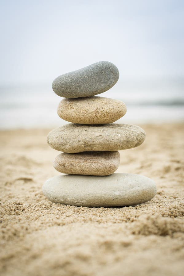 Stacked stones on sand stock photo. Image of environment - 24363970