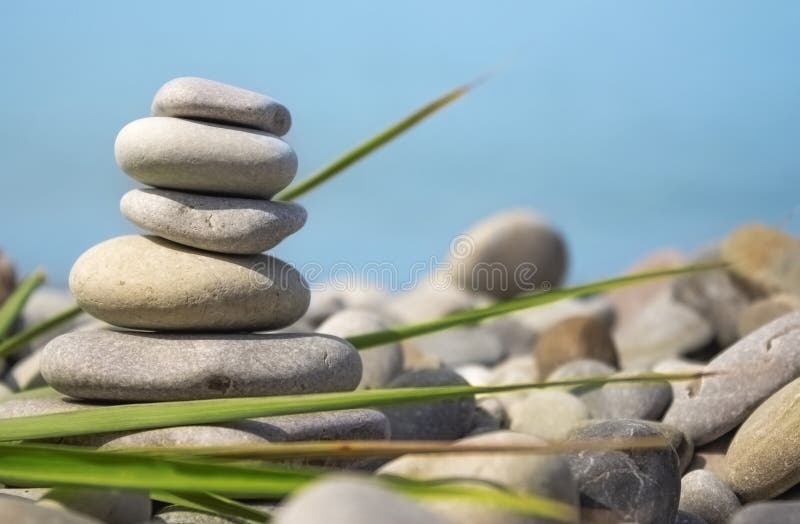 The Stones of the Pyramid Balance on the Beach Against the Background ...