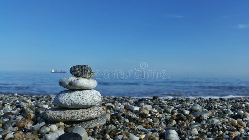A Stones Pyramid on the Beach Stock Photo - Image of outdoor, pyramid ...