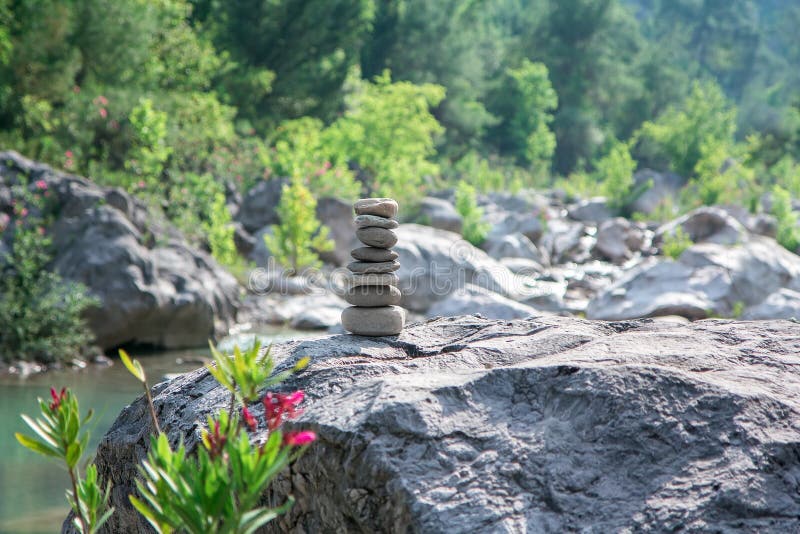 Stones Pyramid on Rock Symbolizing Stability, Zen, Harmony. Stock Photo ...