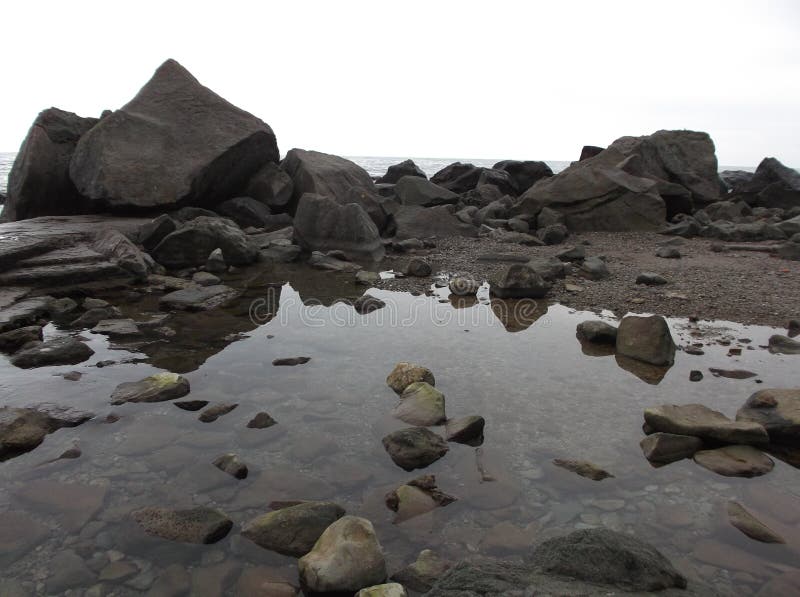 Big rocks in the water stock photo. Image of foam, storm - 255502638