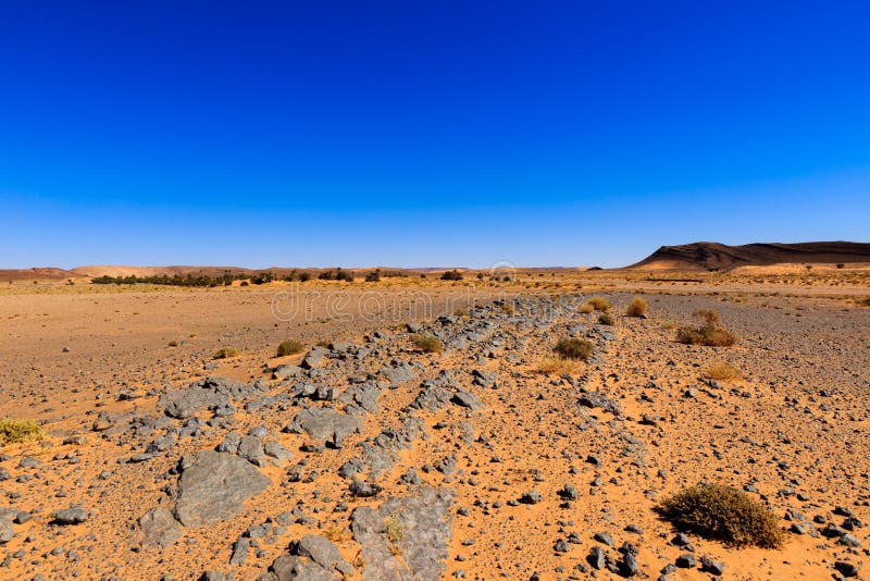 Stones in Sahara desert stock photo. Image of valley - 68201032