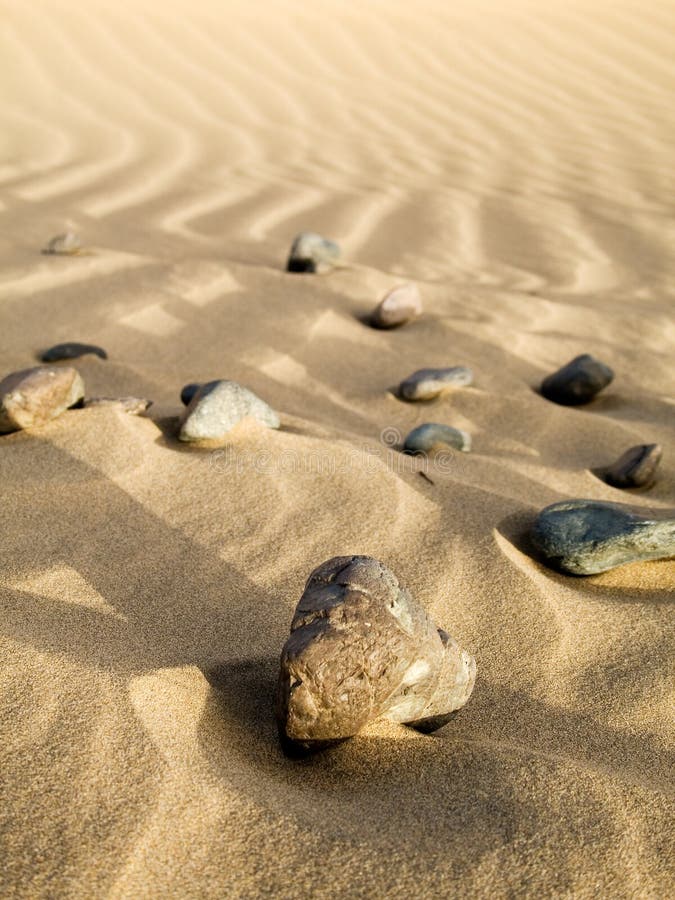 Stones in the sand stock photo. Image of island, round - 5255218