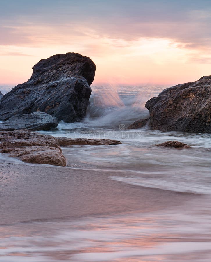 Stones at the Seaside. Splash of Waves in the Sun at Dawn Stock Photo ...