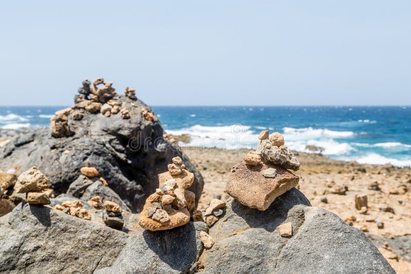 Stones Stacked on Black Volcanic Rock Stock Image - Image of rock ...