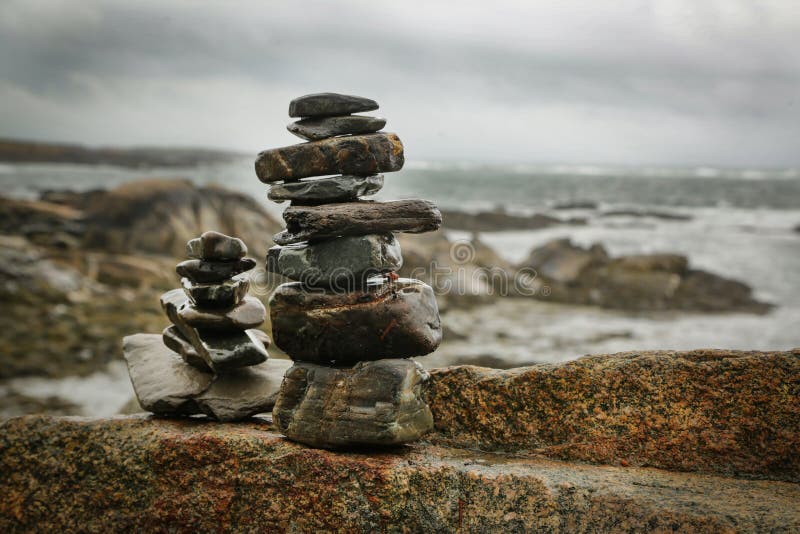 Stones Stacked on a Rocky Shoreline Stock Photo - Image of dramatic ...