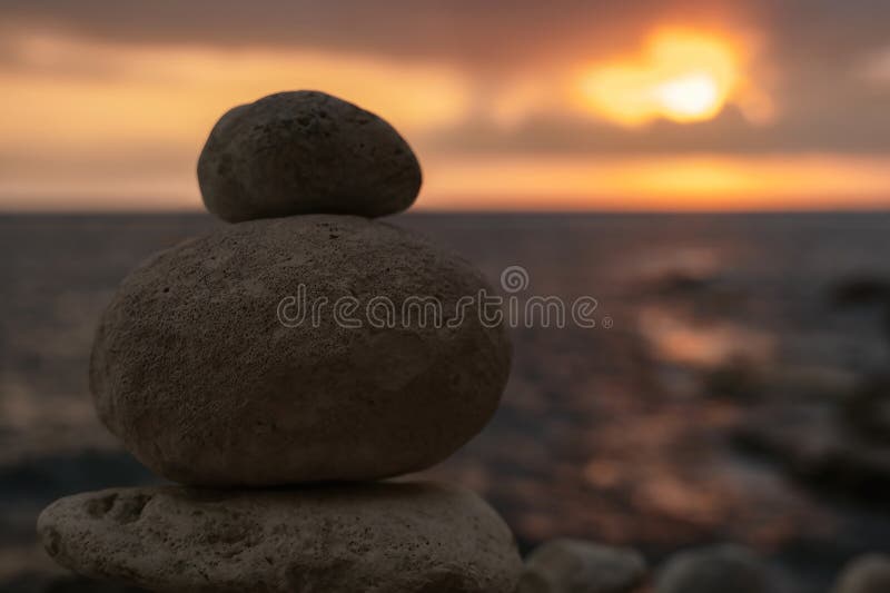 Stones Stacked Sunset Beach - a Balanced Stack of Rocks Stands on a ...