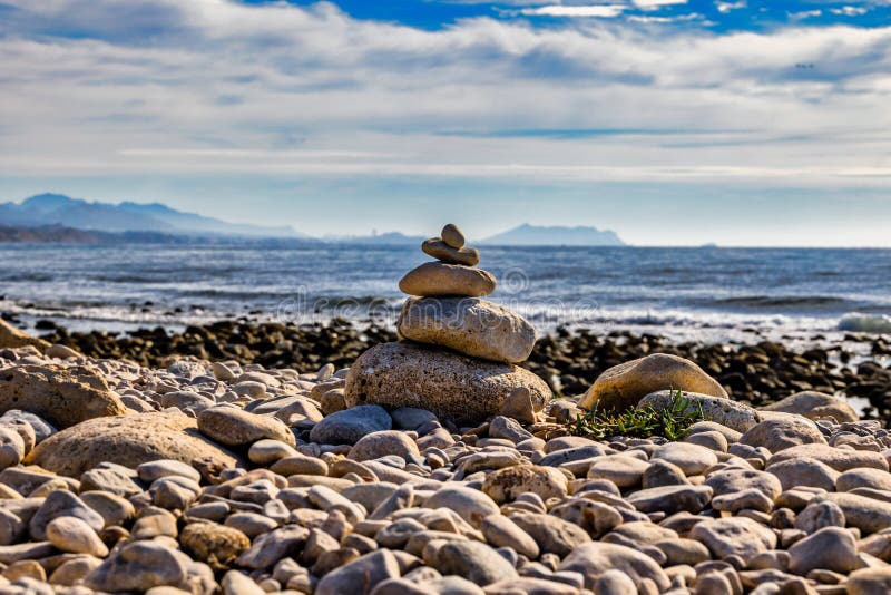 Stones Stacked in Towers on a Pebble Beach Stock Photo - Image of ...