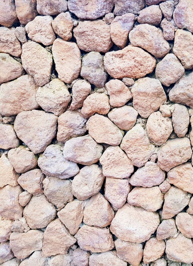 Stones are Sticking on the Wall with Random Structure Stock Image ...