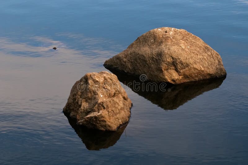 Stones and Their Reflections in the Water Stock Image - Image of coast ...