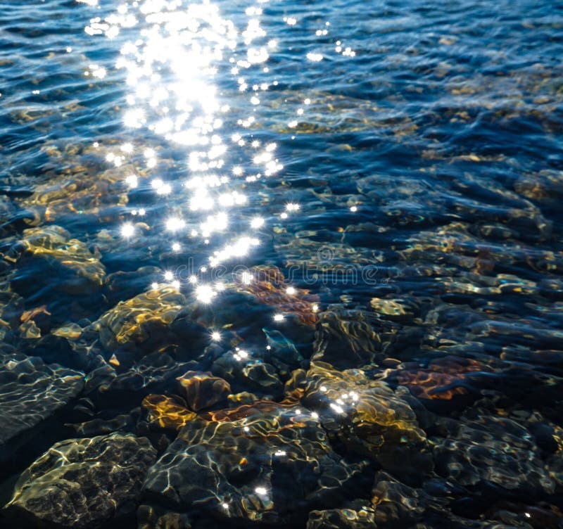 Stones Under Clear Sea Water, Sun Glare on the Water Stock Photo ...