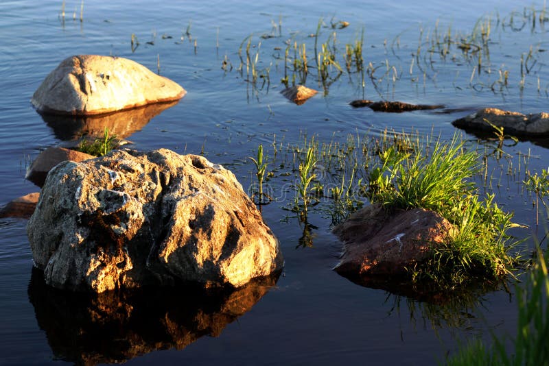 Stones in the water stock image. Image of blue, stone - 91063715