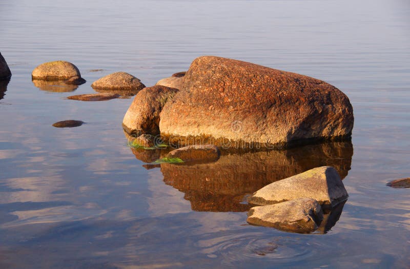 Stones in water two stock image. Image of river, sunset - 221909283