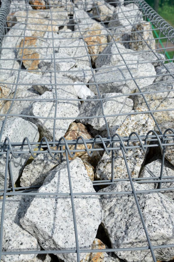 Stones in wire net stock photo. Image of surface, backdrop - 55323088