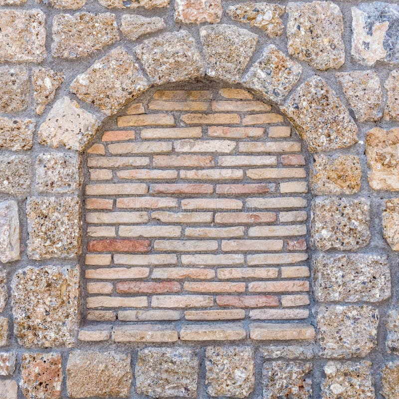 A Stonewall with Arch Frame Shape Cavity and Brickwork, Textured ...