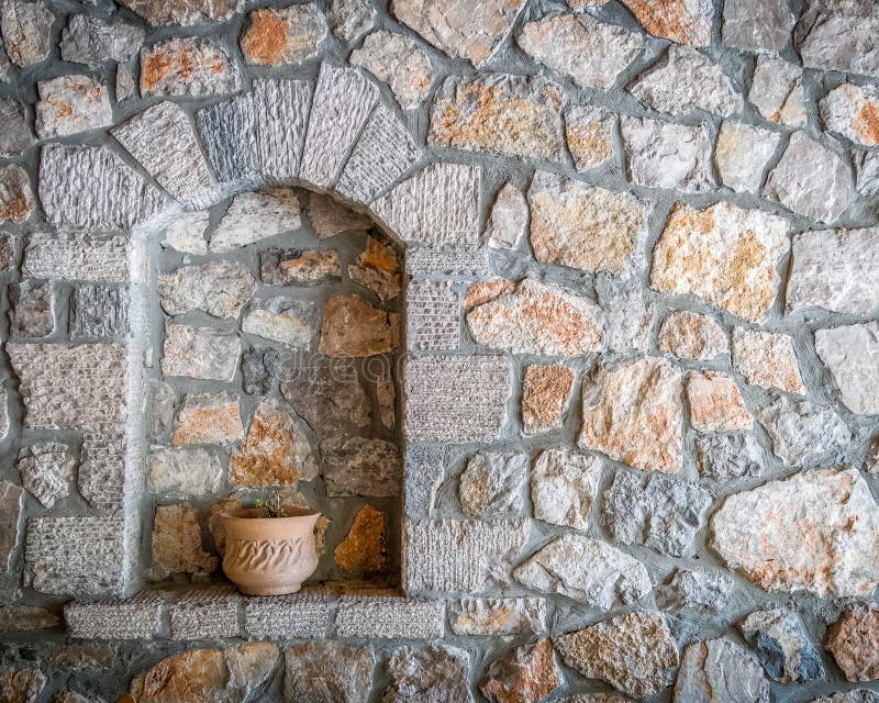 A Stonewall with an Arched Frame Shape Cavity and Ceramic Pot, Rough ...