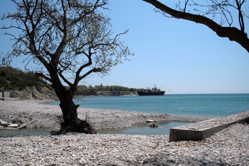 Stony Shore and Ship at the Pier Stock Photo - Image of water ...