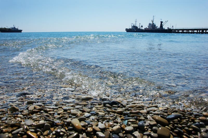 Stony Shore and Ship at the Pier Stock Image - Image of shadow, sony ...