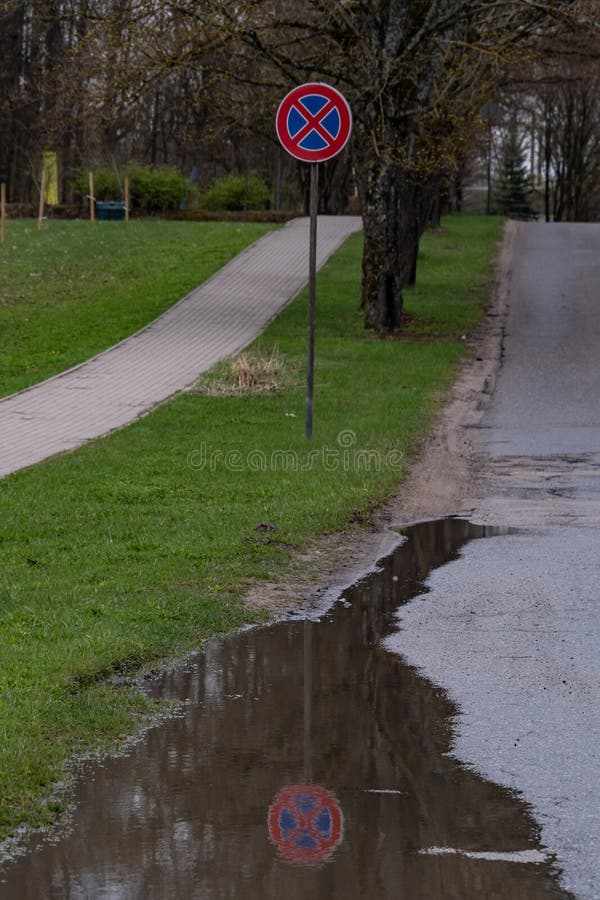 Stop Banned - a Reflection of a Road Sign in a Puddle Stock Image ...