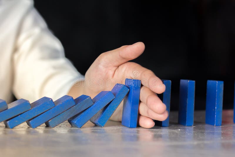 Businessman Stop Domino Effect. Risk Management Concept Stock Image ...