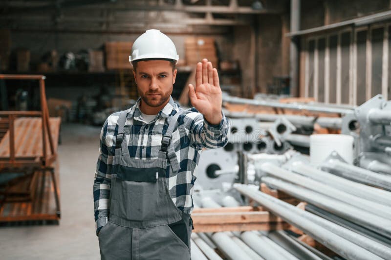 Stop Gesture. Factory Male Worker in Uniform is Indoors Stock Image ...