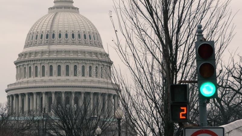 A Stop Light Changes Color in Front of the US Capitol Building in ...