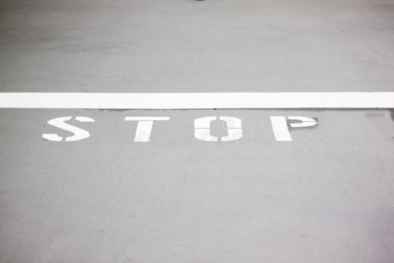Stop message on pavement stock photo. Image of street - 27377518