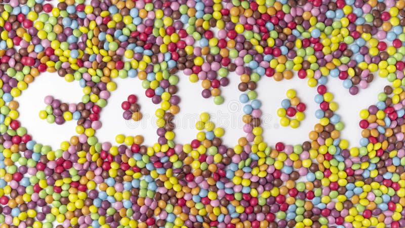 Stop Motion Animation of Multicolored Dragee Make Text Candy. Stock ...