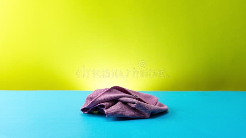 Stop Motion Animation of Pile Clothes on Blue Table Seamless Loop Video ...