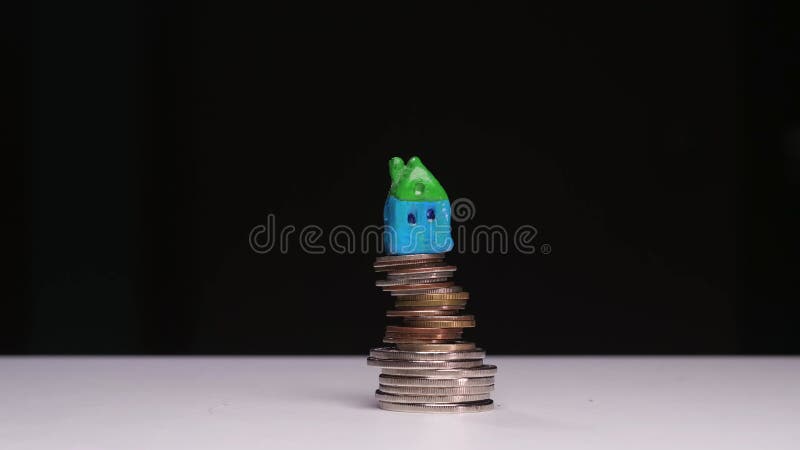 Stop Motion Animation House Rises on a Stack of Coins. the Stack of ...