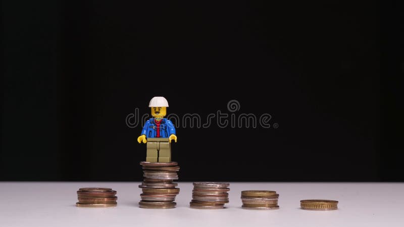Stop Motion Man Worker Climbs on a Stack of Coins. Career Growth ...