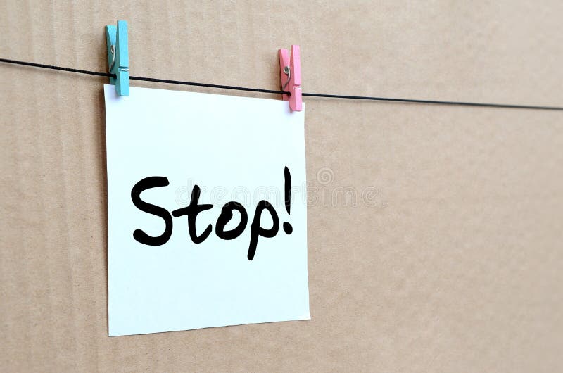 Stop! Note is Written on a White Sticker that Hangs with a Cloth Stock ...