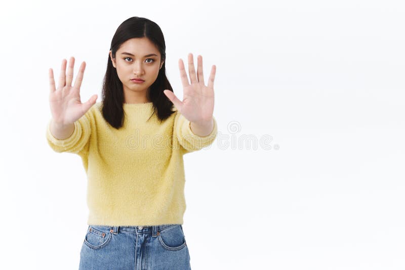 Stop Right There. Serious-looking Asian Girl Pulling Hands Forward in ...