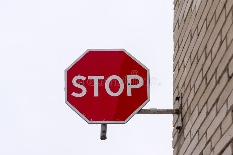 Stop Road Sign Mounted on the Wall Stock Photo - Image of people ...