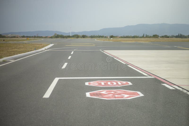Stop Sign on Airport Runway Stock Image - Image of terminal, signs ...