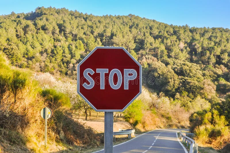 Stop Sign in the Background of Beautiful Landscape and Road. Stock ...