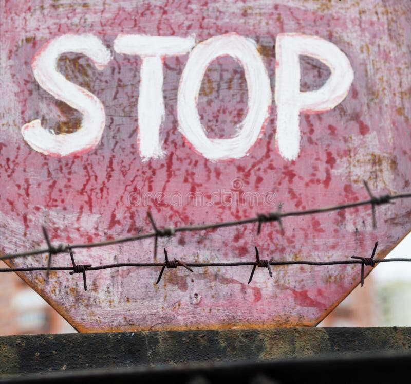 Stop Sign Behind the Barbed Wire Stock Photo - Image of caution ...