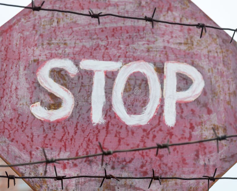 Stop Sign Behind the Barbed Wire Stock Image - Image of abstract ...